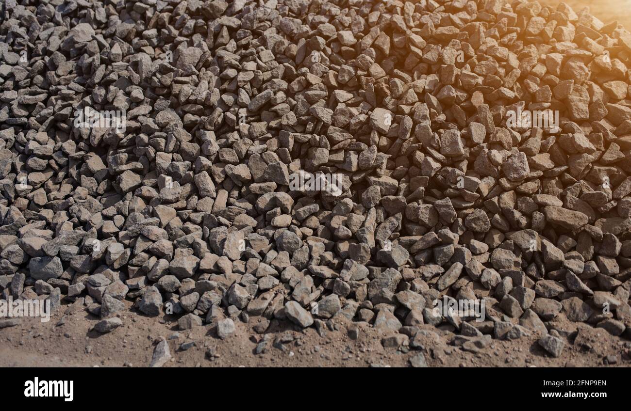 Gray rock, crushed for construction on the ground. Texture background ...