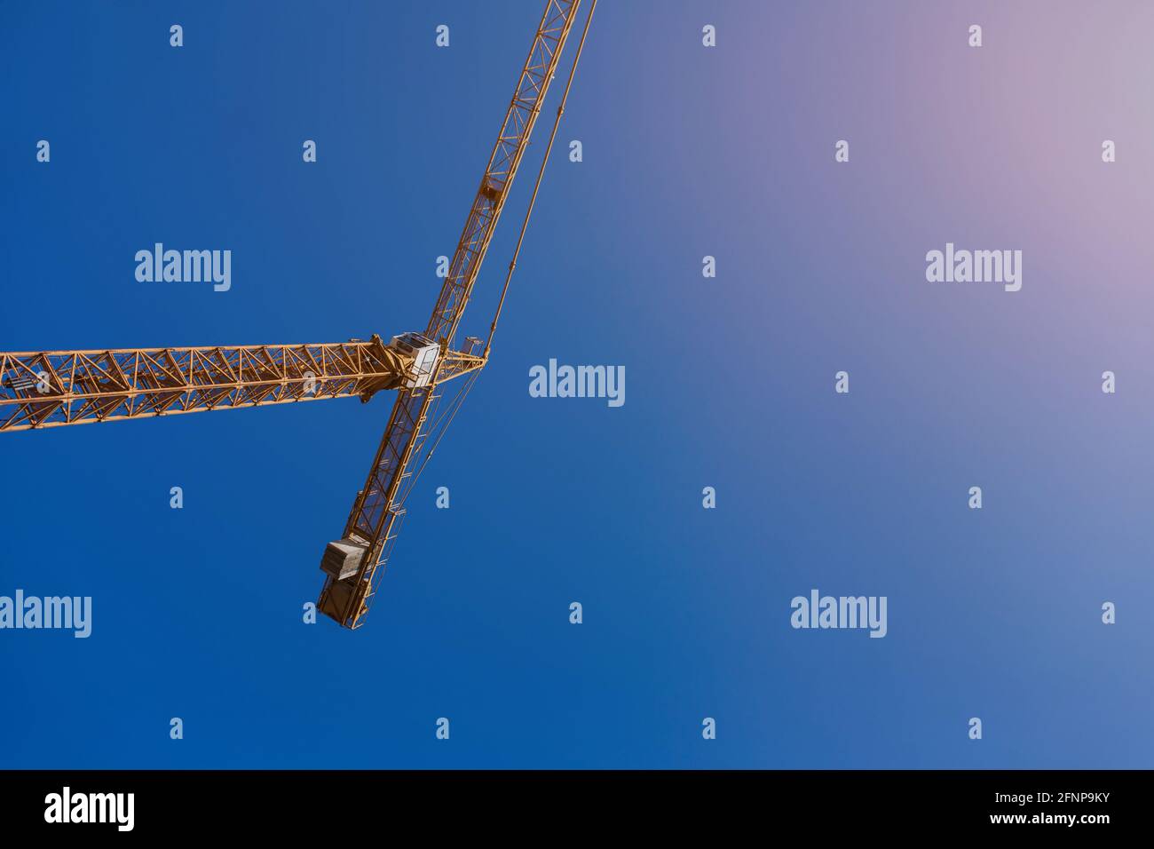 tower crane on the background of the blue sky. copy space Stock Photo ...