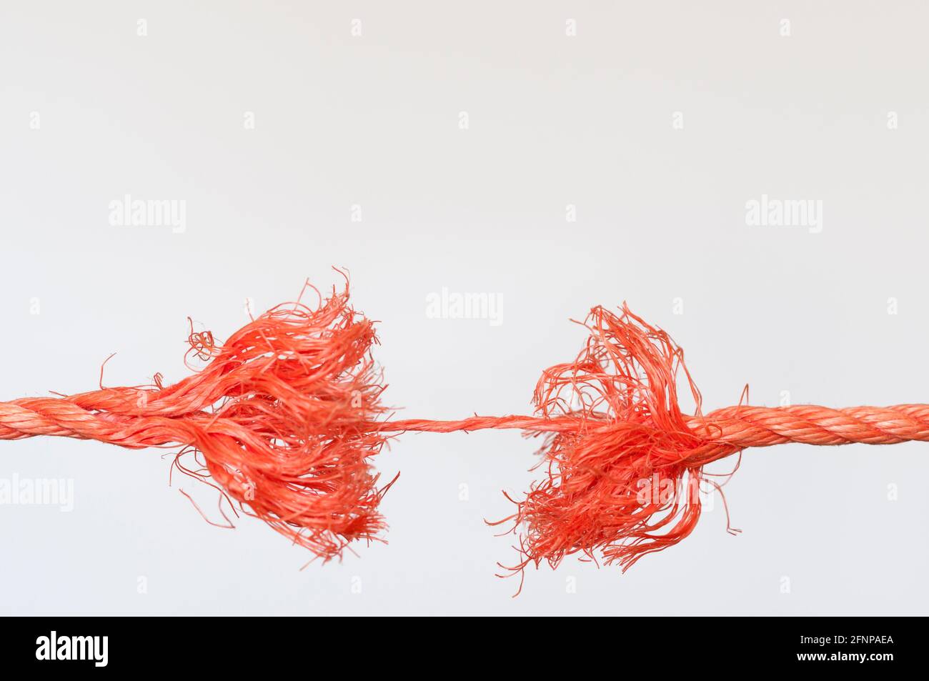 Rope about to break. The rope just hanging by a thread Stock Photo - Alamy