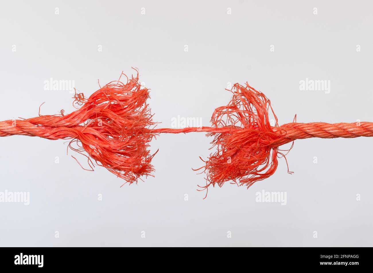 Rope about to break. The rope just hanging by a thread Stock Photo - Alamy