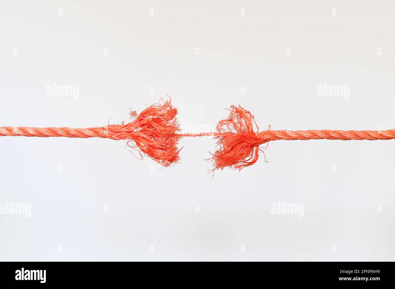 Rope about to break. The rope just hanging by a thread Stock Photo - Alamy