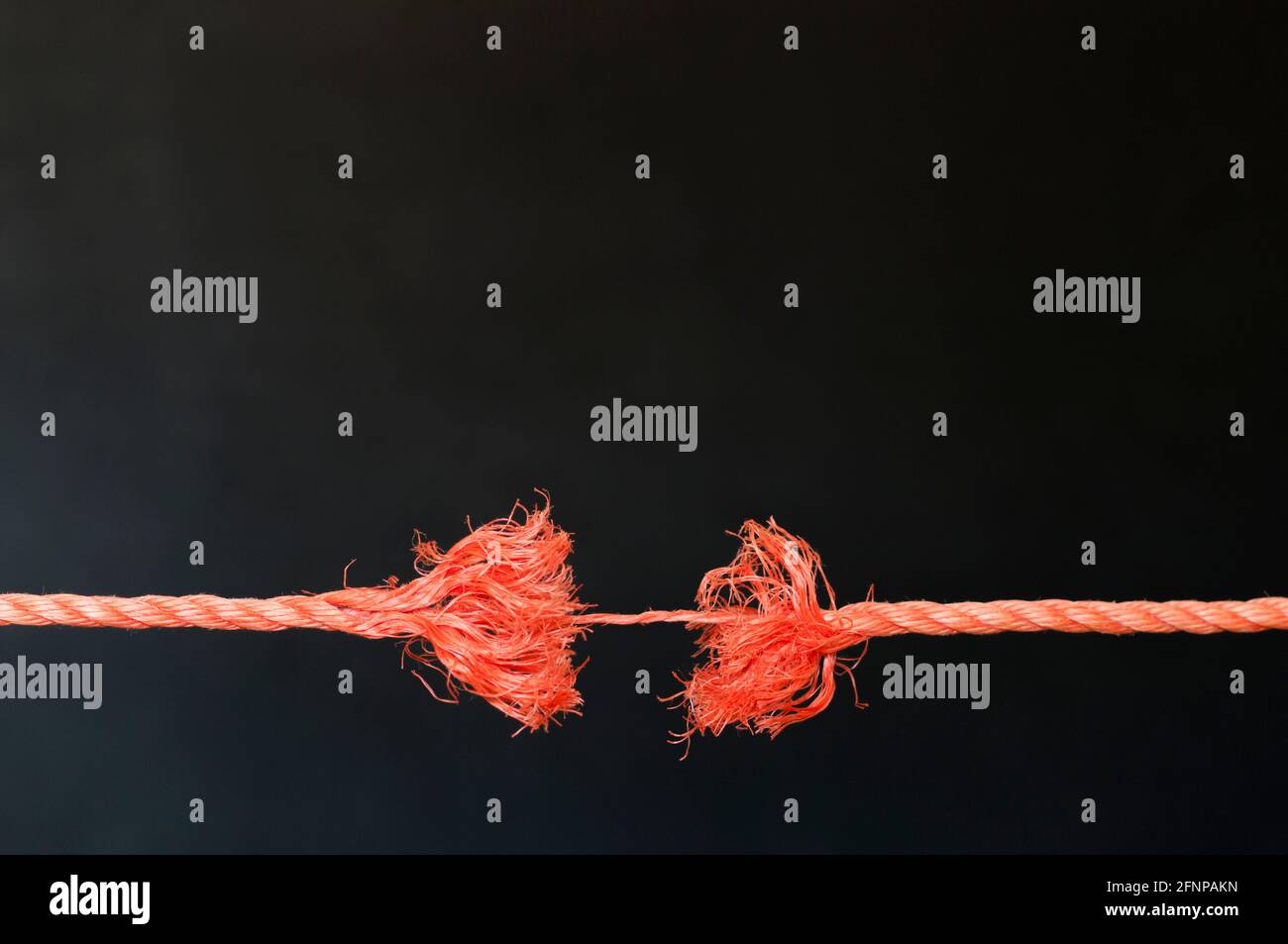 Rope about to break. The rope just hanging by a thread Stock Photo - Alamy