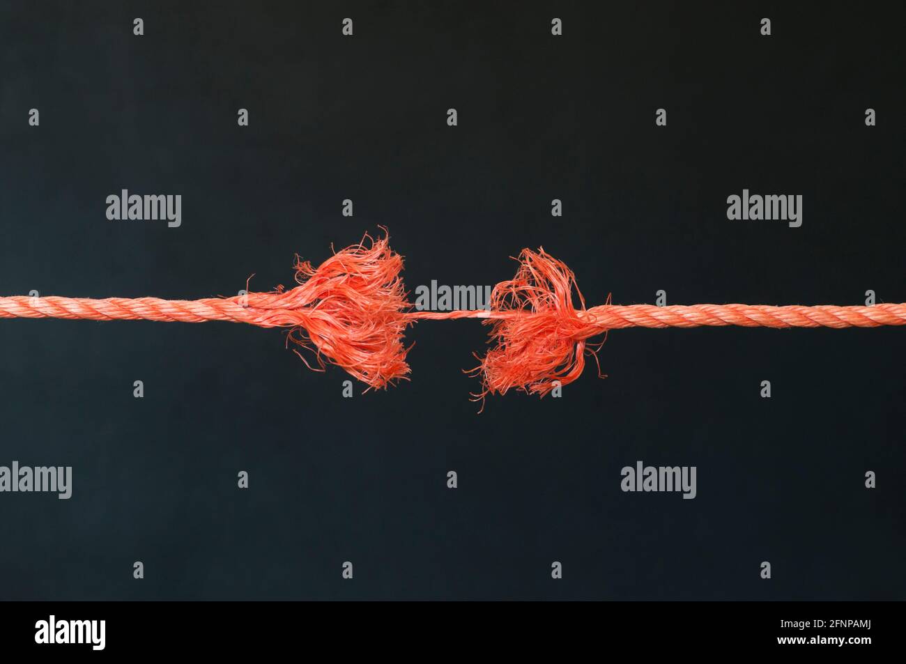 Rope about to break. The rope just hanging by a thread Stock Photo - Alamy