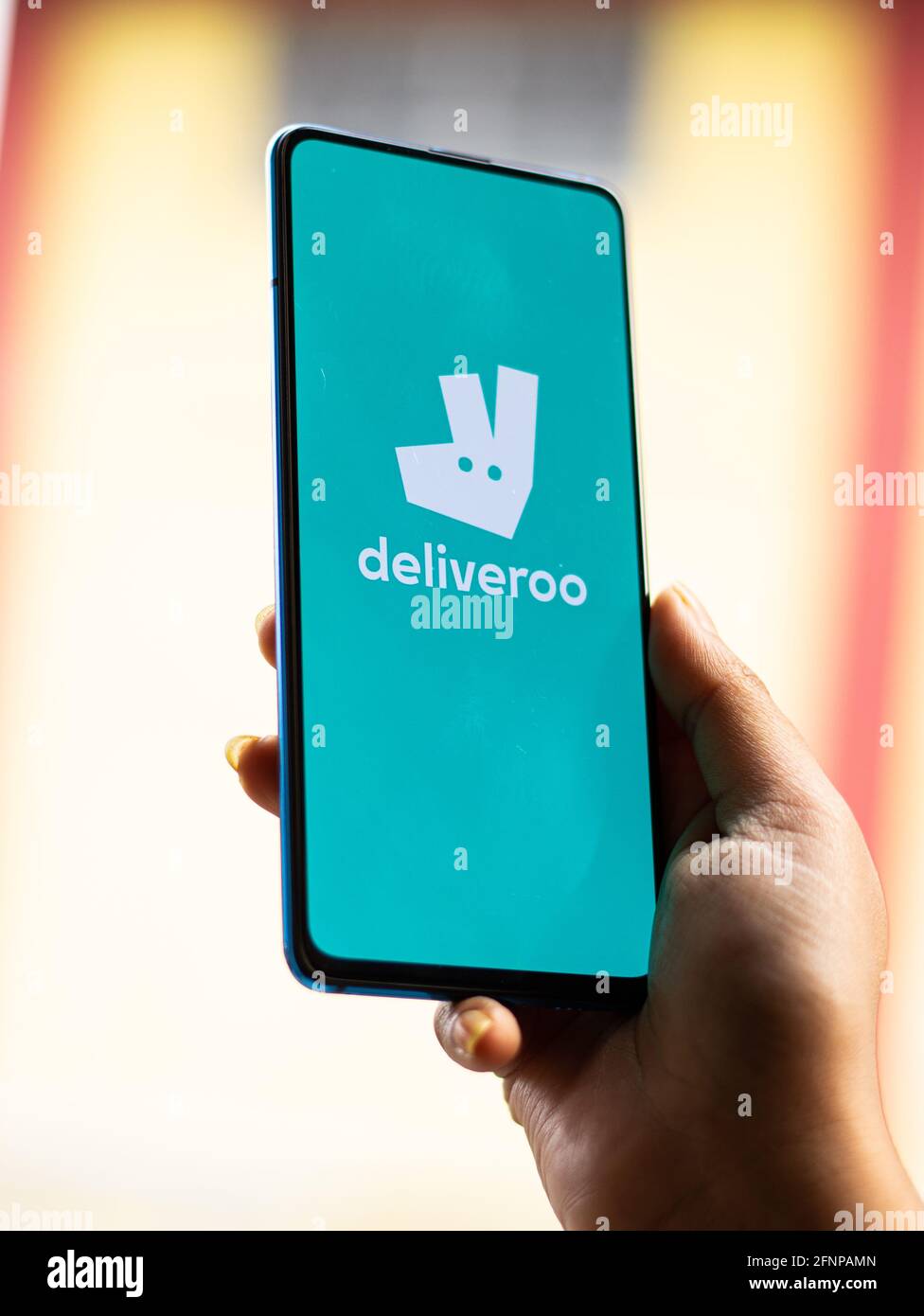 Deliveroo food delivery app on smartphone screen hi-res stock ...