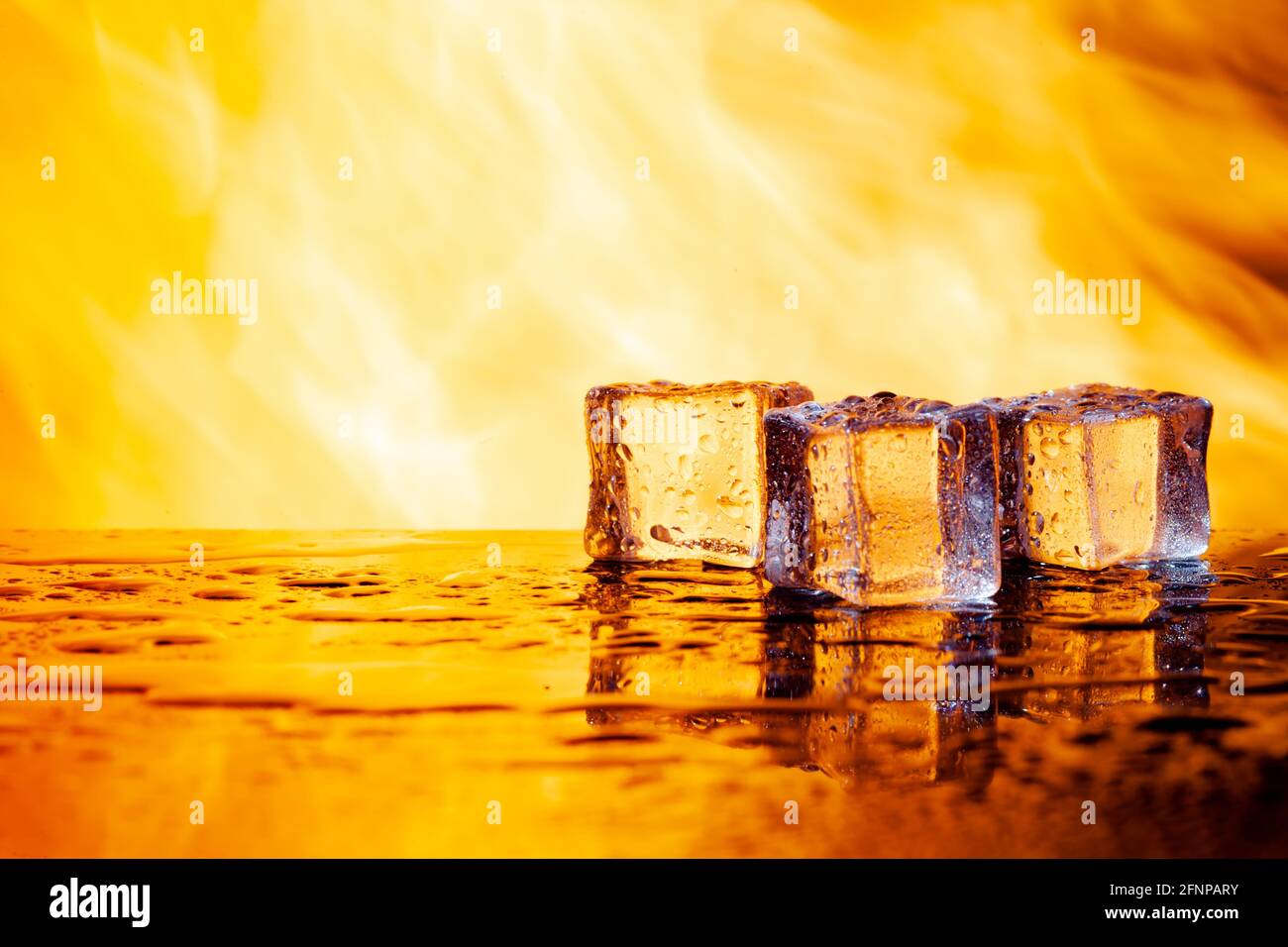 fire and ice cubes on a black background, place under the text Stock ...