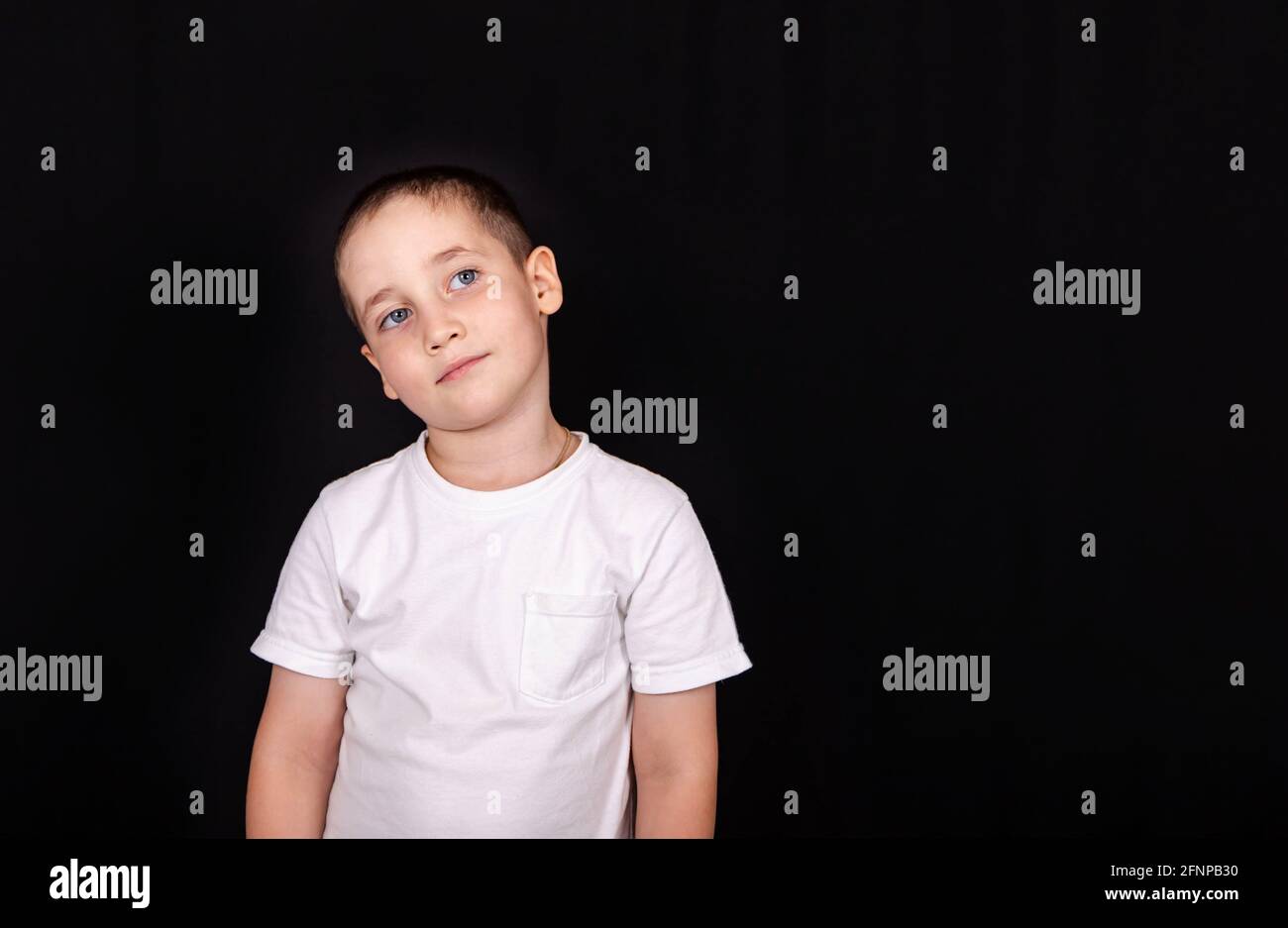 Portrait of cheerful kid boy isolated over black background Stock Photo ...