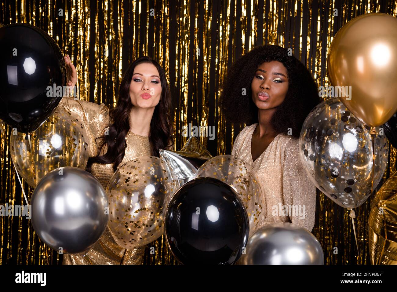 Photo of pretty classy ladies send air kiss look camera balloon party ...