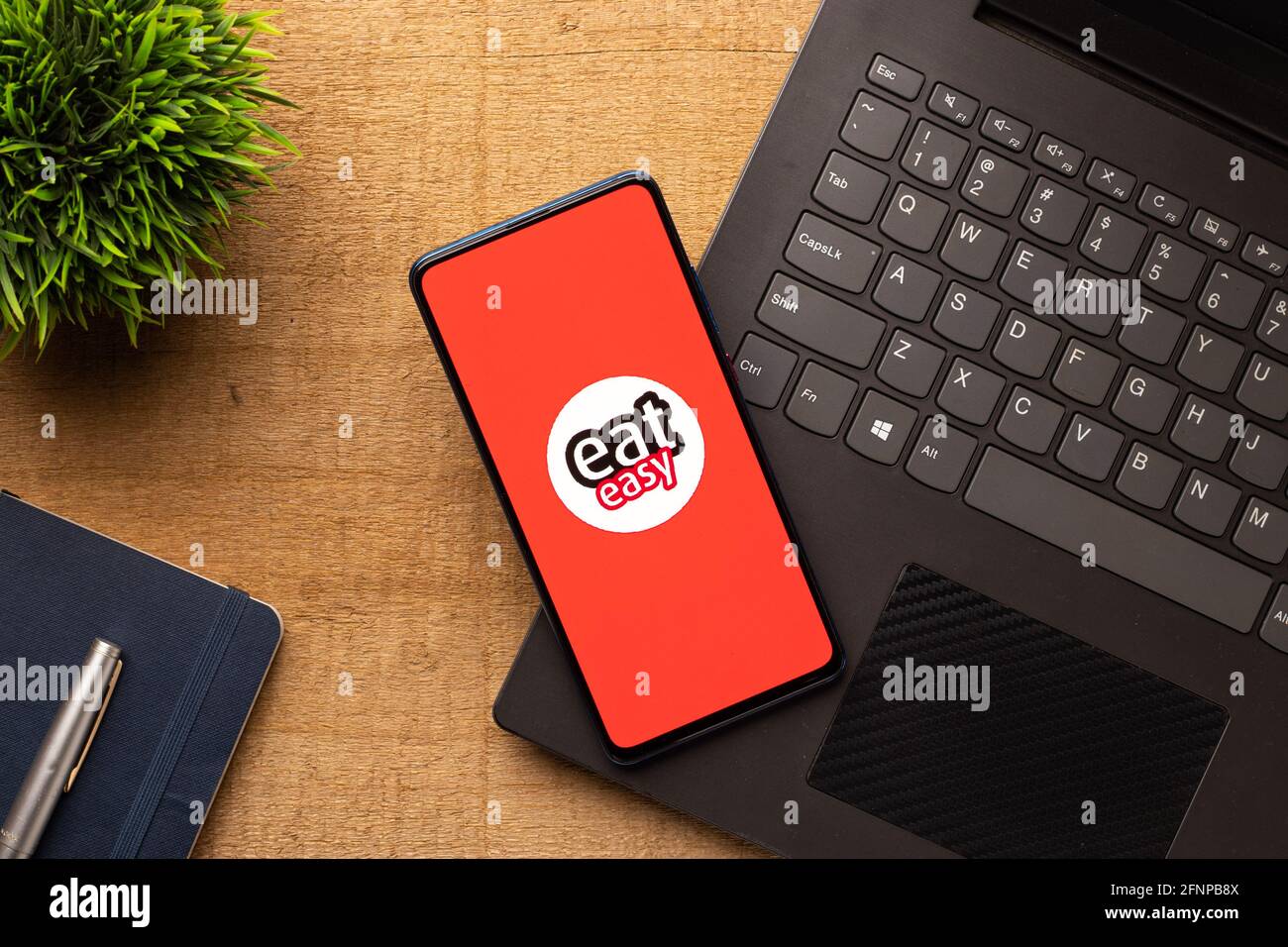 Assam, india - May 18, 2021 : Eat Easy logo on phone screen stock image ...