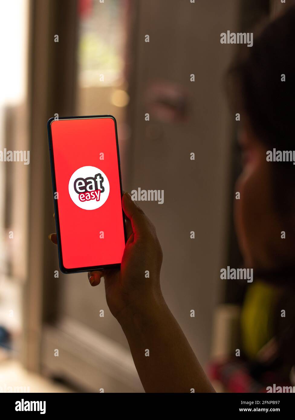 Assam, india - May 18, 2021 : Eat Easy logo on phone screen stock image ...