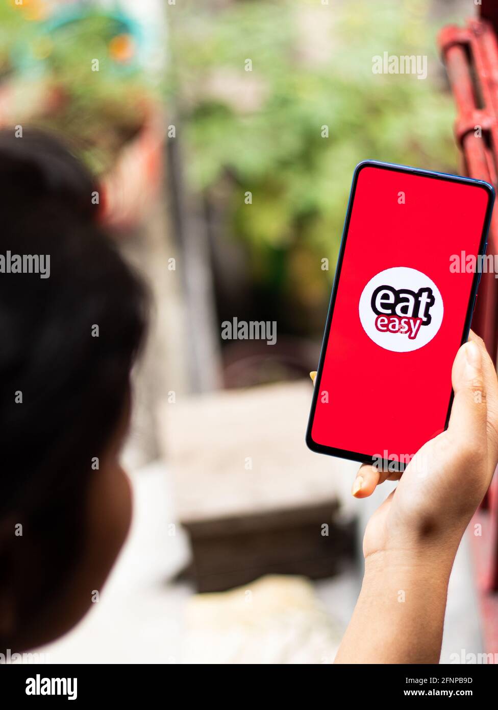 Assam, india - May 18, 2021 : Eat Easy logo on phone screen stock image ...