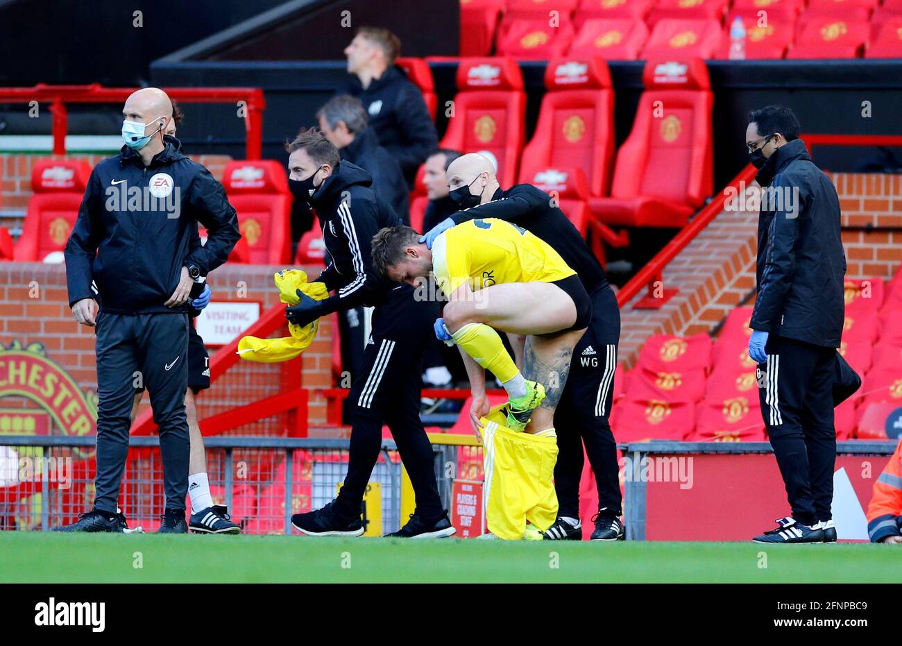 Fulham's Joe Bryan gets changed pitch side during the Premier League ...