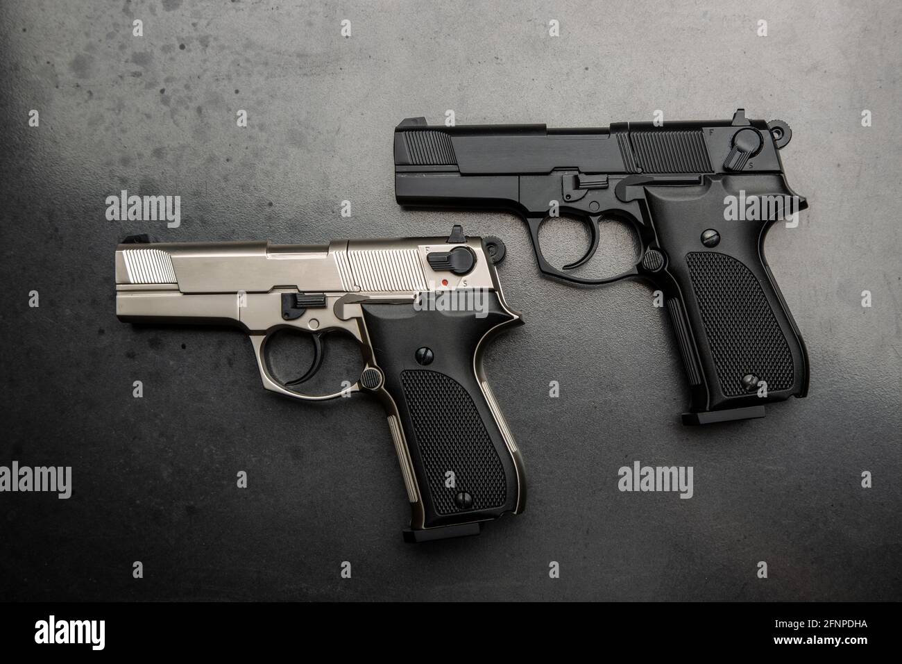 Silver pistols hi-res stock photography and images - Alamy