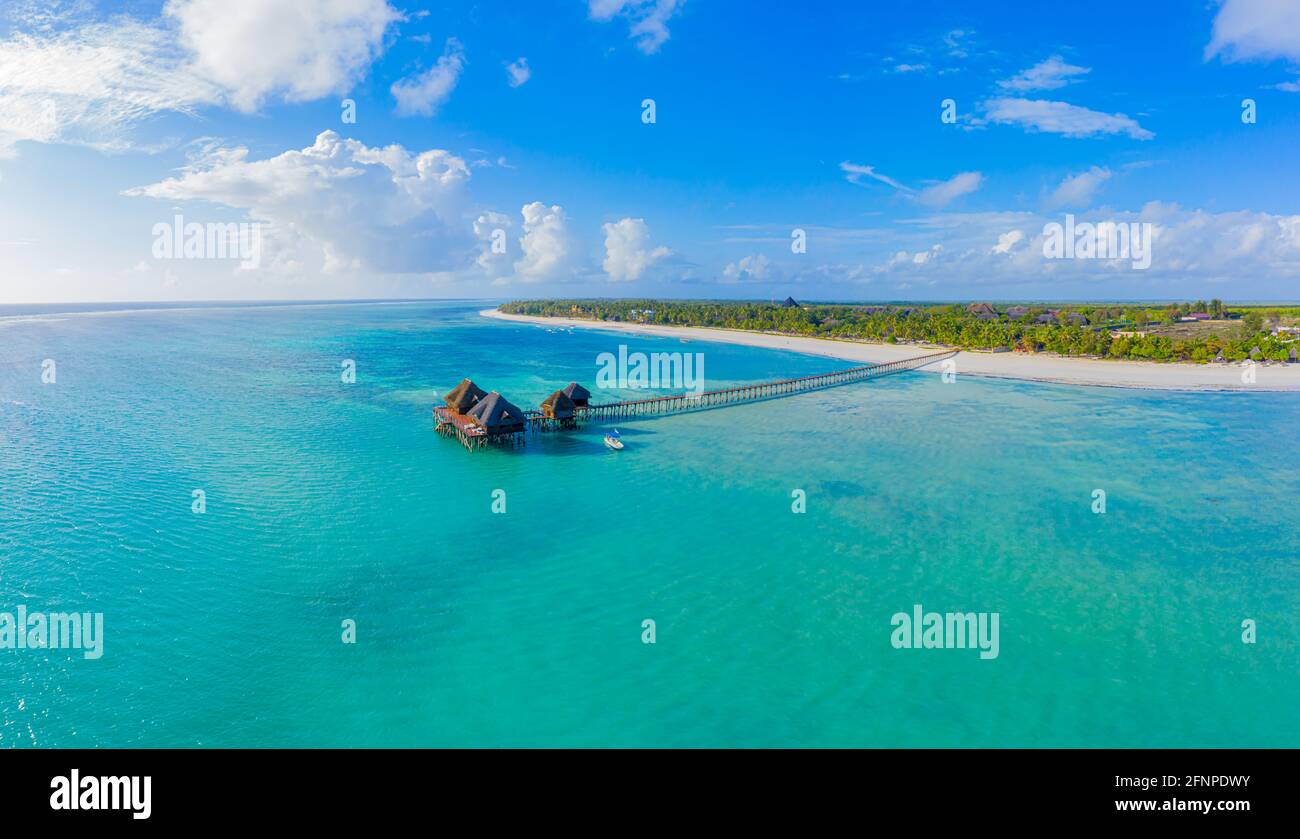 Aerial view of Maldives island, luxury water villas resort and wooden ...