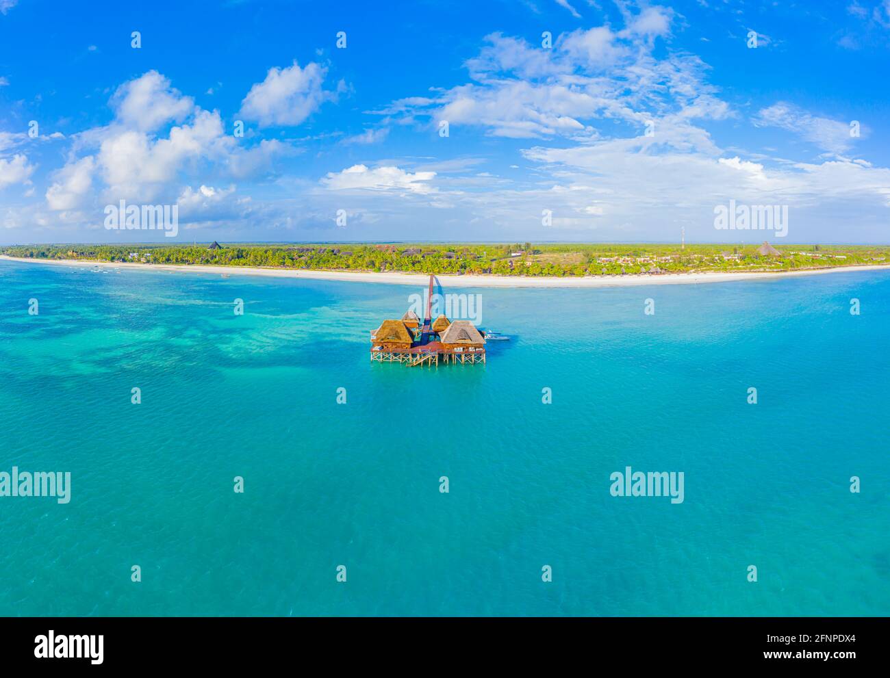 Aerial view of Maldives island, luxury water villas resort and wooden ...