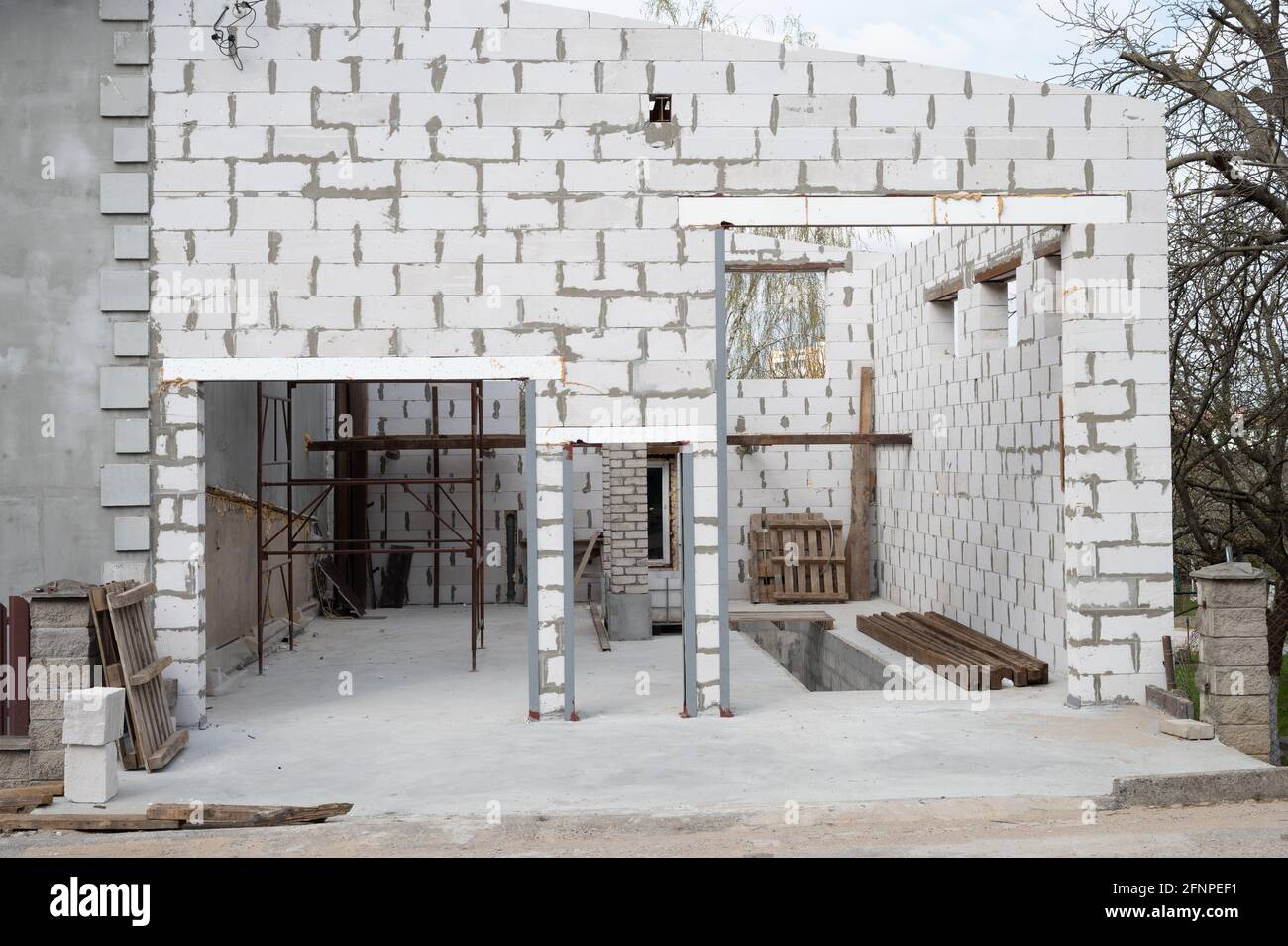 Construction of a garage from foam blocks. for cars and trucks Stock ...