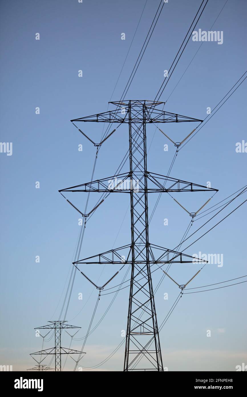 Vertical shot of a transmission tower under a clear Stock Photo - Alamy