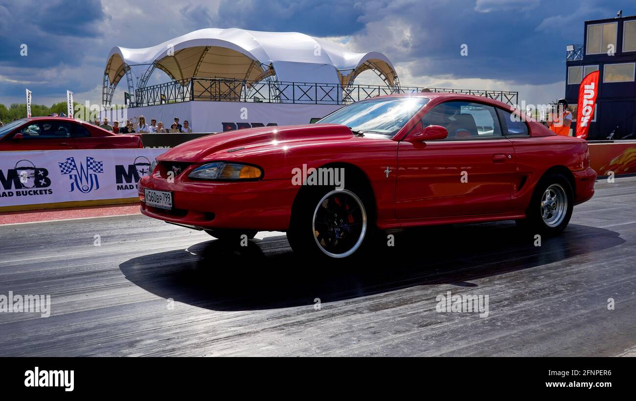 A red sports car starts off in high speed during the event. The annual ...