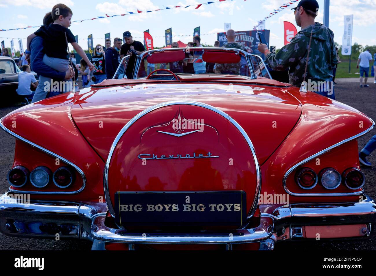 Red retro car seen during the event. The annual classic drag races of ...