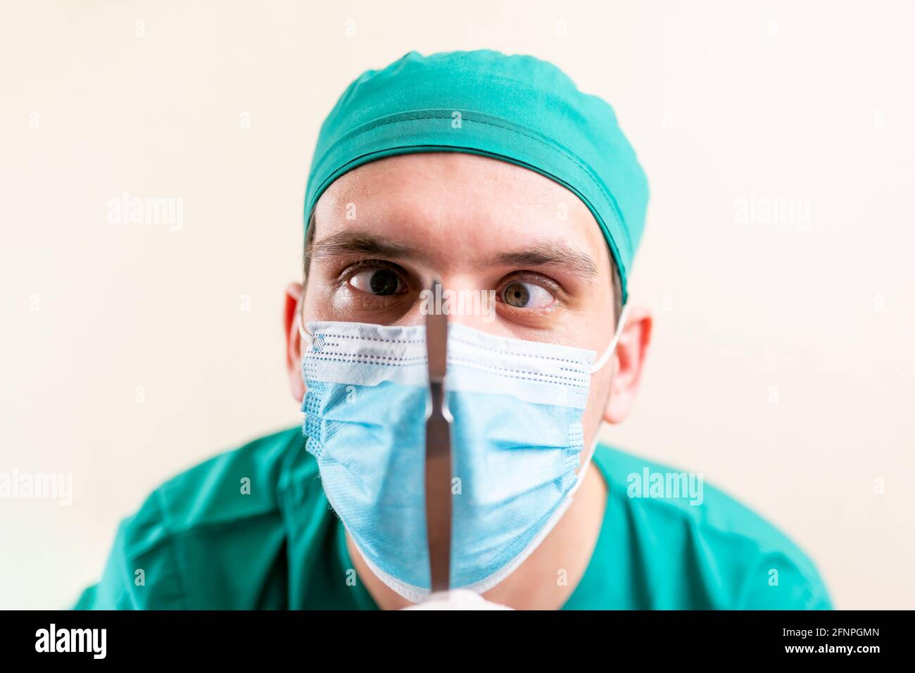 Funny doctor with a scalpel in his hands. High quality photo Stock ...