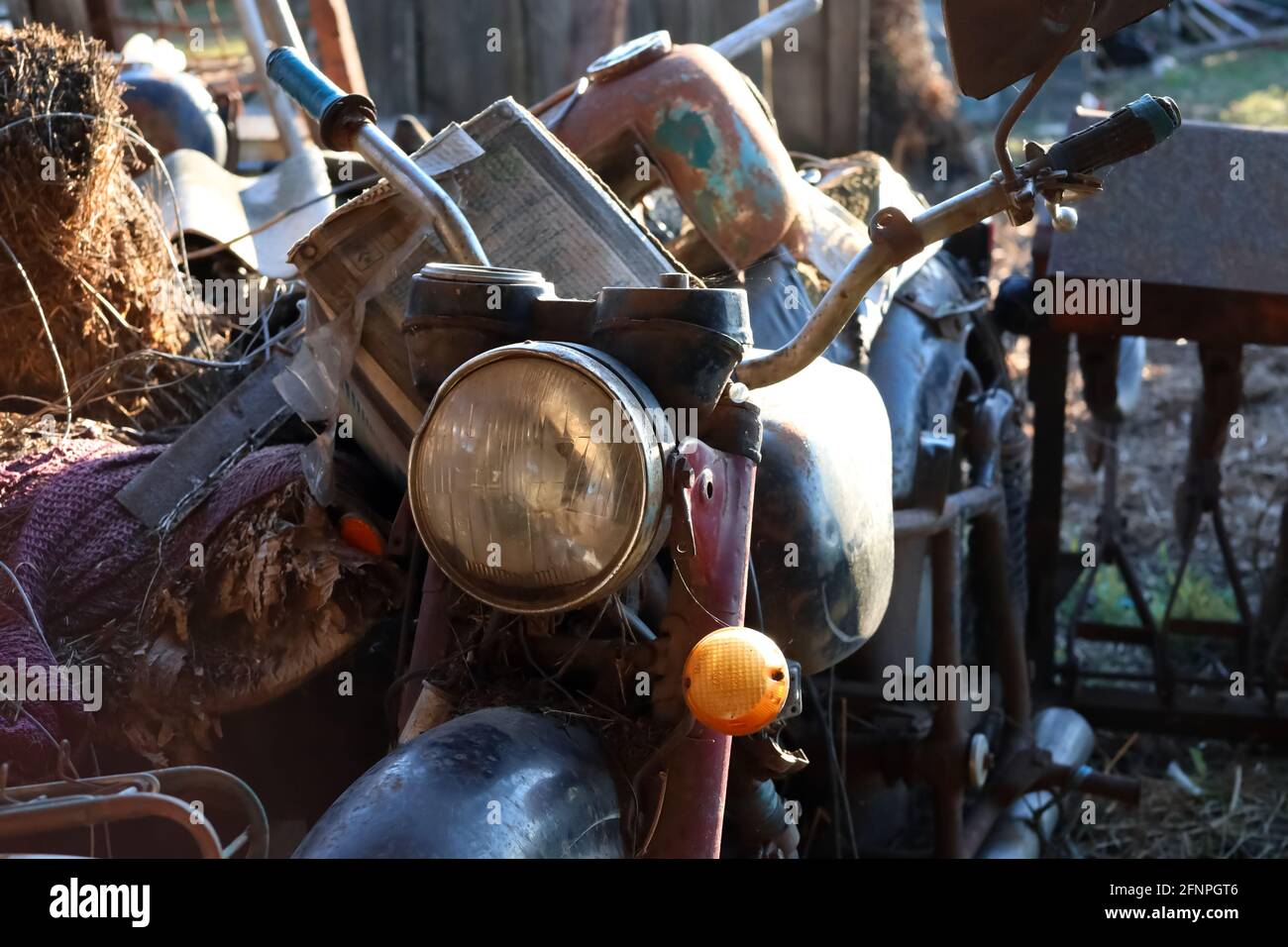 An old broken motorcycle is in the hayloft Stock Photo - Alamy