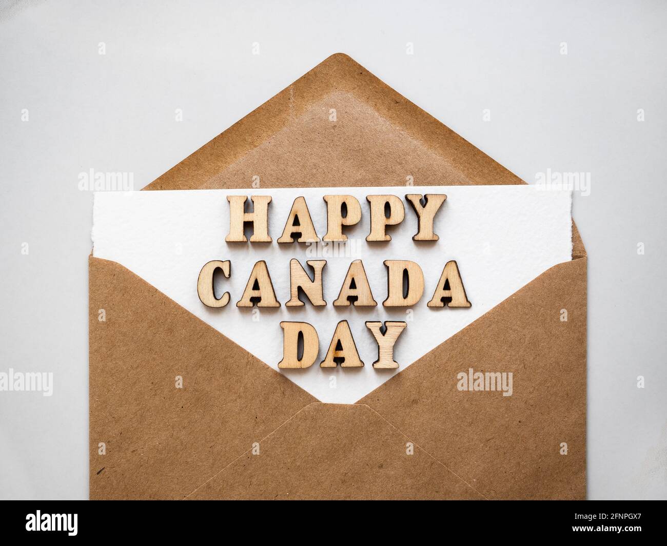 Happy Canadian Day. Postal envelope painted in the national colors of ...