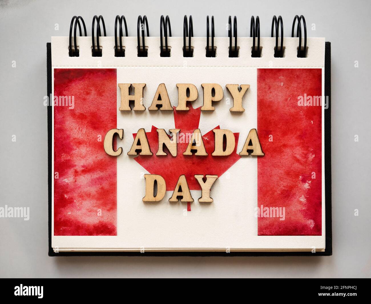 Happy Canadian Day. Postal envelope painted in the national colors of ...