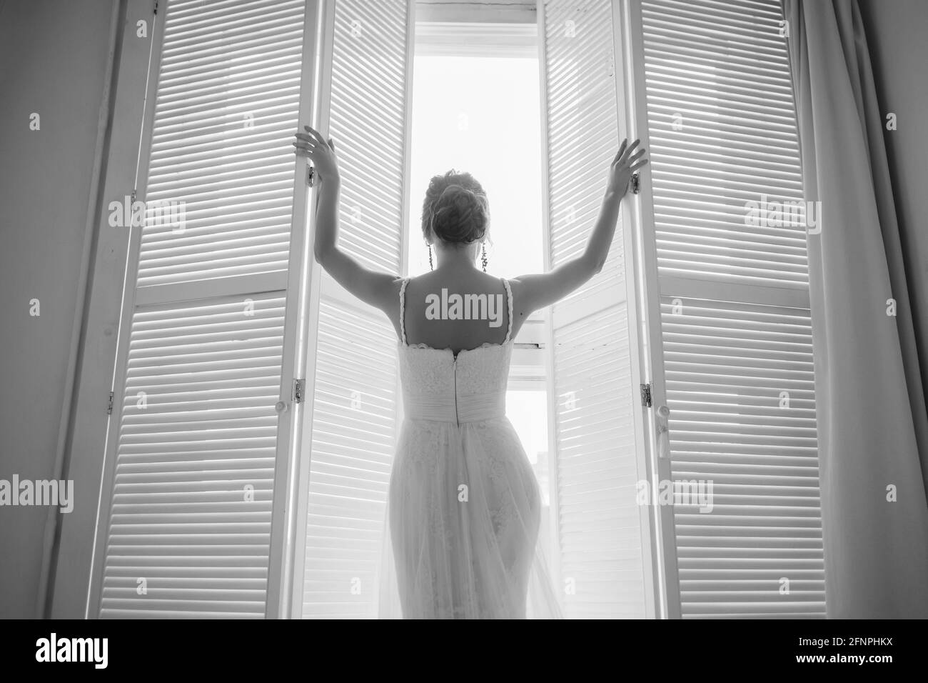 black and white portrait of the bride at the window Stock Photo - Alamy