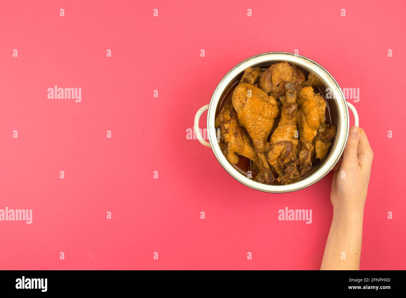 Woman presenting roasted chicken food for a family dinner, minimalist ...