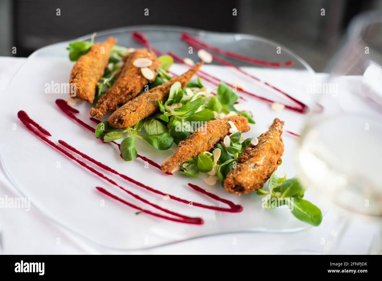 Crispy deep fried small fish in Italian style with some delicious salad ...