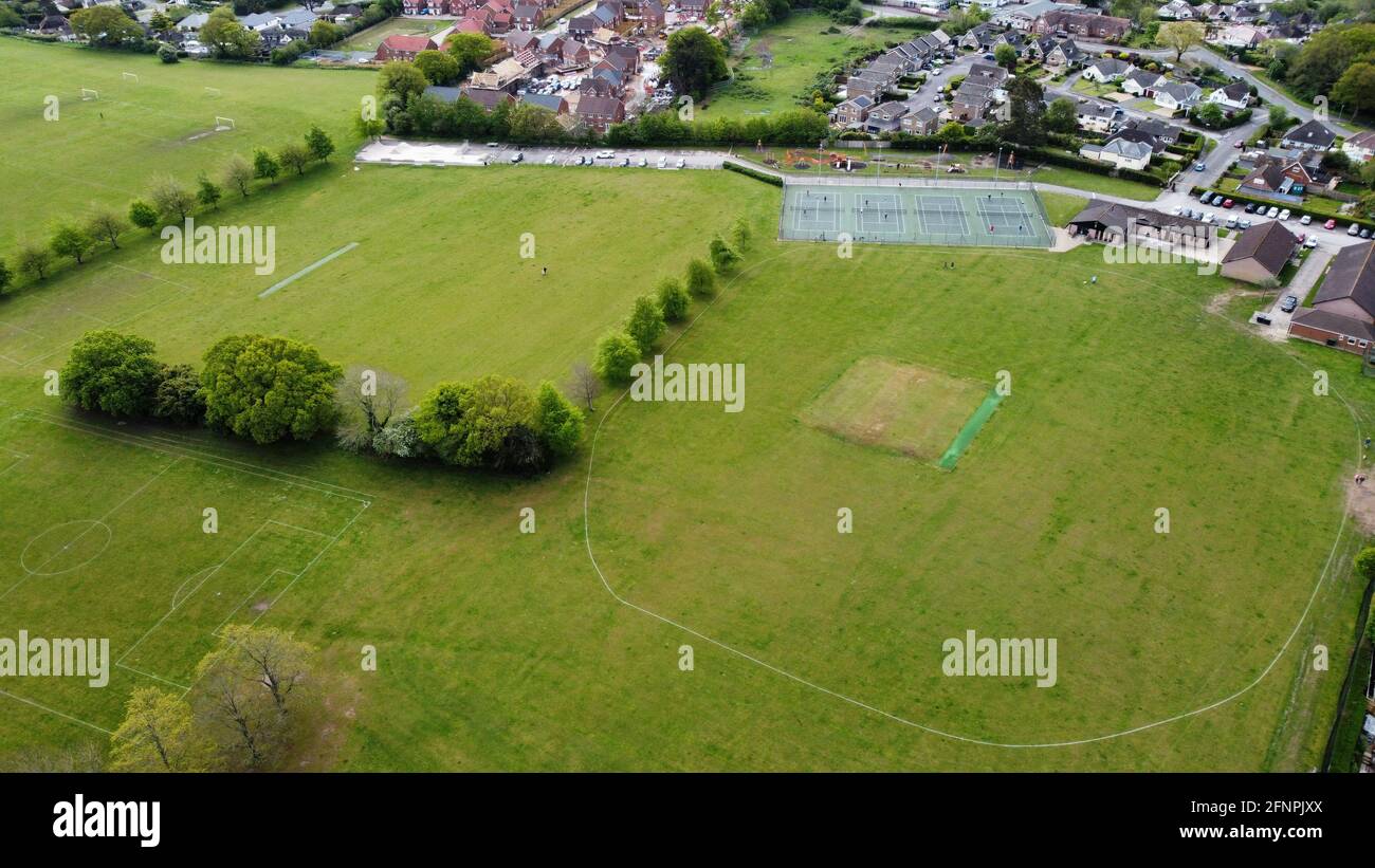Aerial view of playing fields, trees and new housing development Stock ...