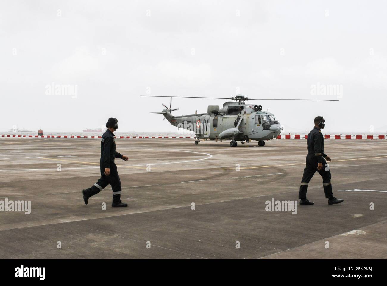 Mumbai, India. 18th May, 2021. An Indian Navy helicopter carrying ...