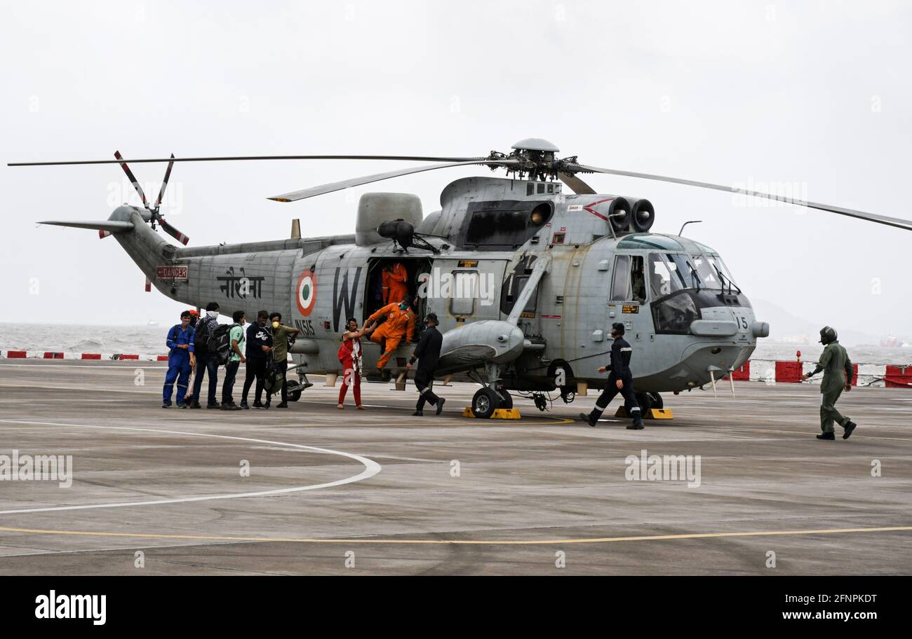 An Indian Navy helicopter carrying rescued employees seen at INS Shikra ...