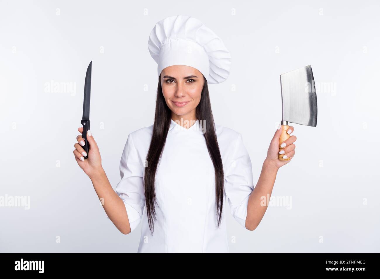 Photo of pretty young girl arms hold two knives look camera wear cap ...