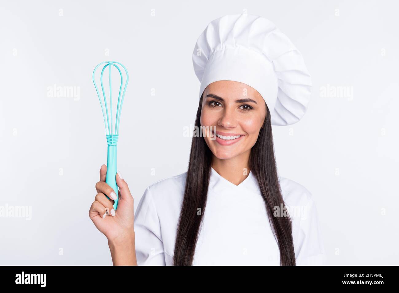 Portrait of pretty positive person arm hold demonstrate whisk toothy ...