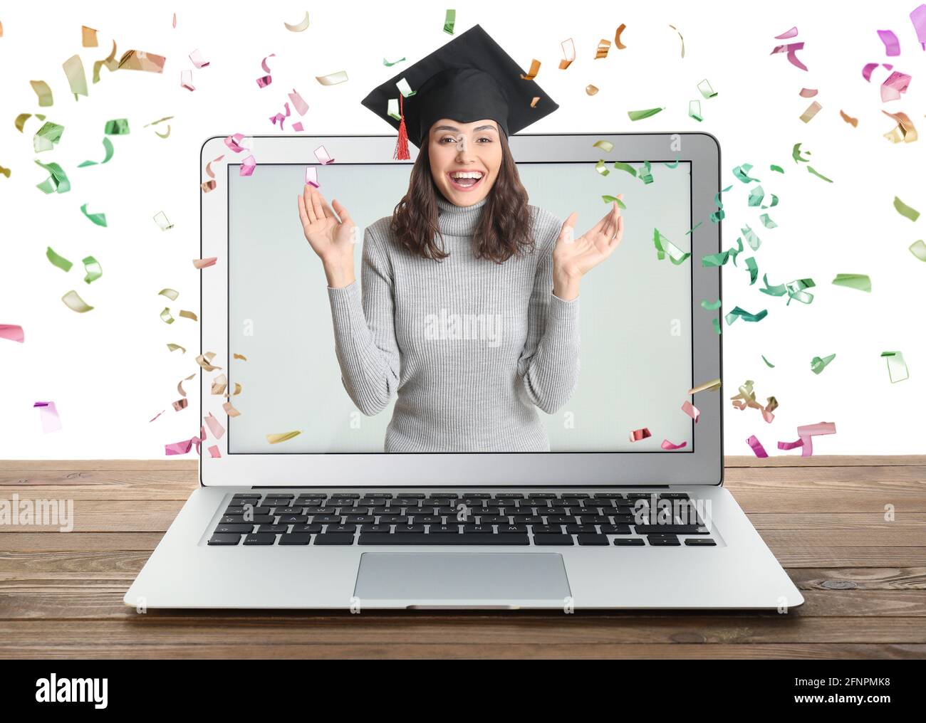 Female graduating student on screen of laptop against white background ...