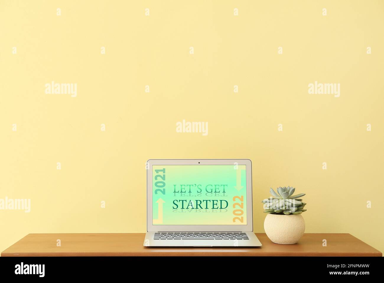 Text LET'S GET START on screen of laptop at workplace in office Stock ...