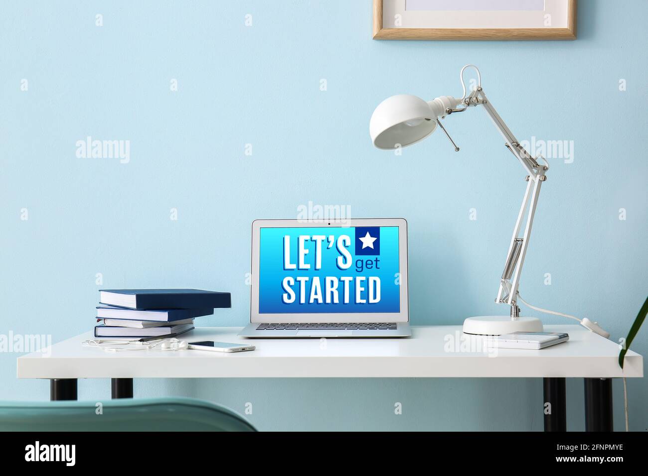 Text LET'S GET START on screen of laptop at workplace in office Stock ...