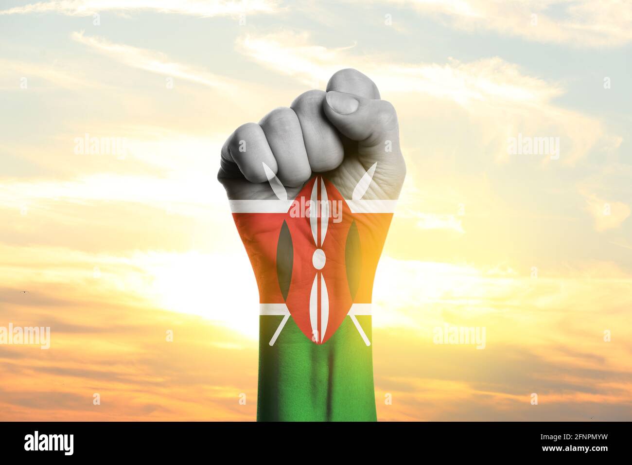 Hand in colors of Kenyan flag at sunrise Stock Photo - Alamy