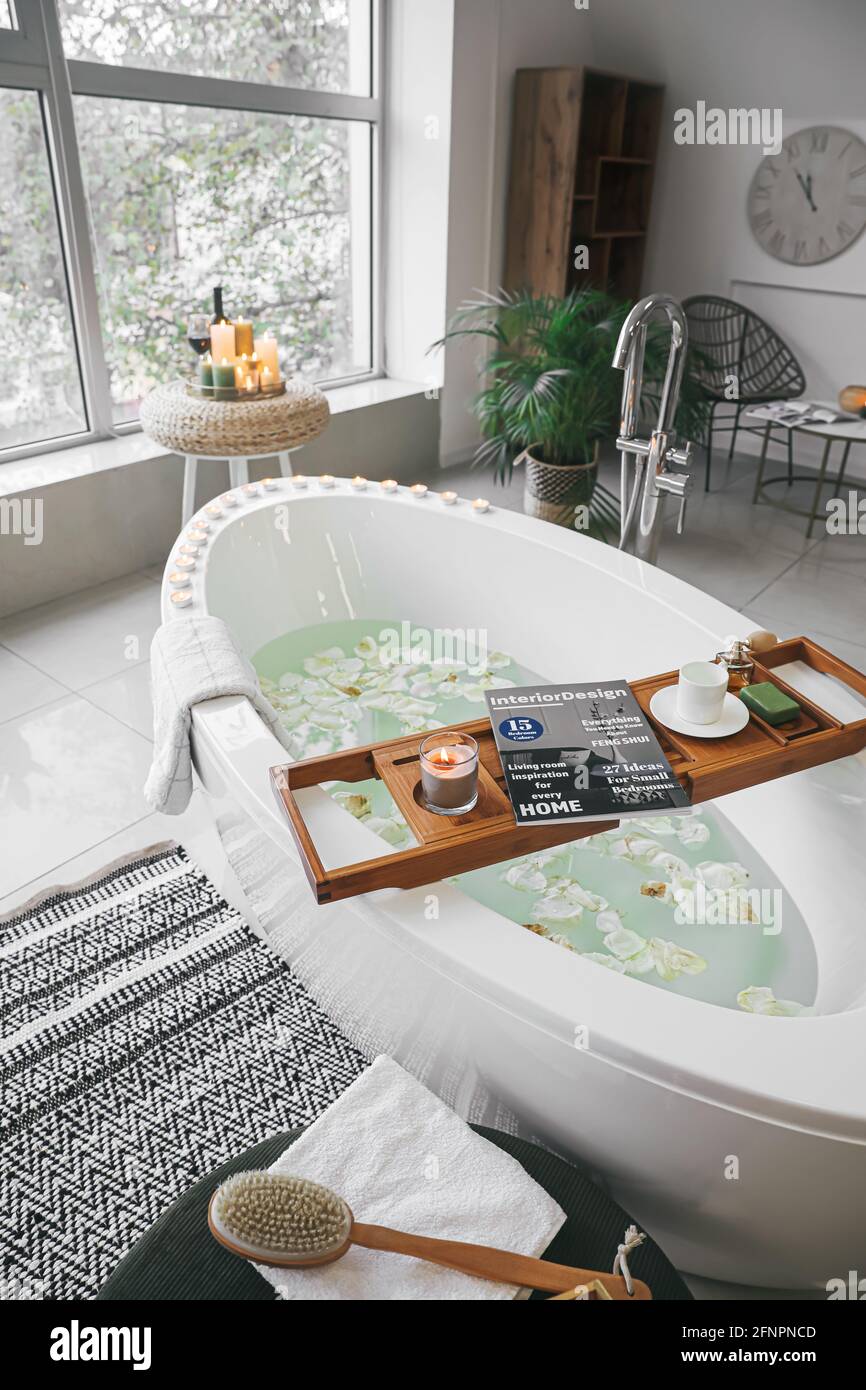 Stylish interior of modern bathroom with burning candles Stock Photo ...