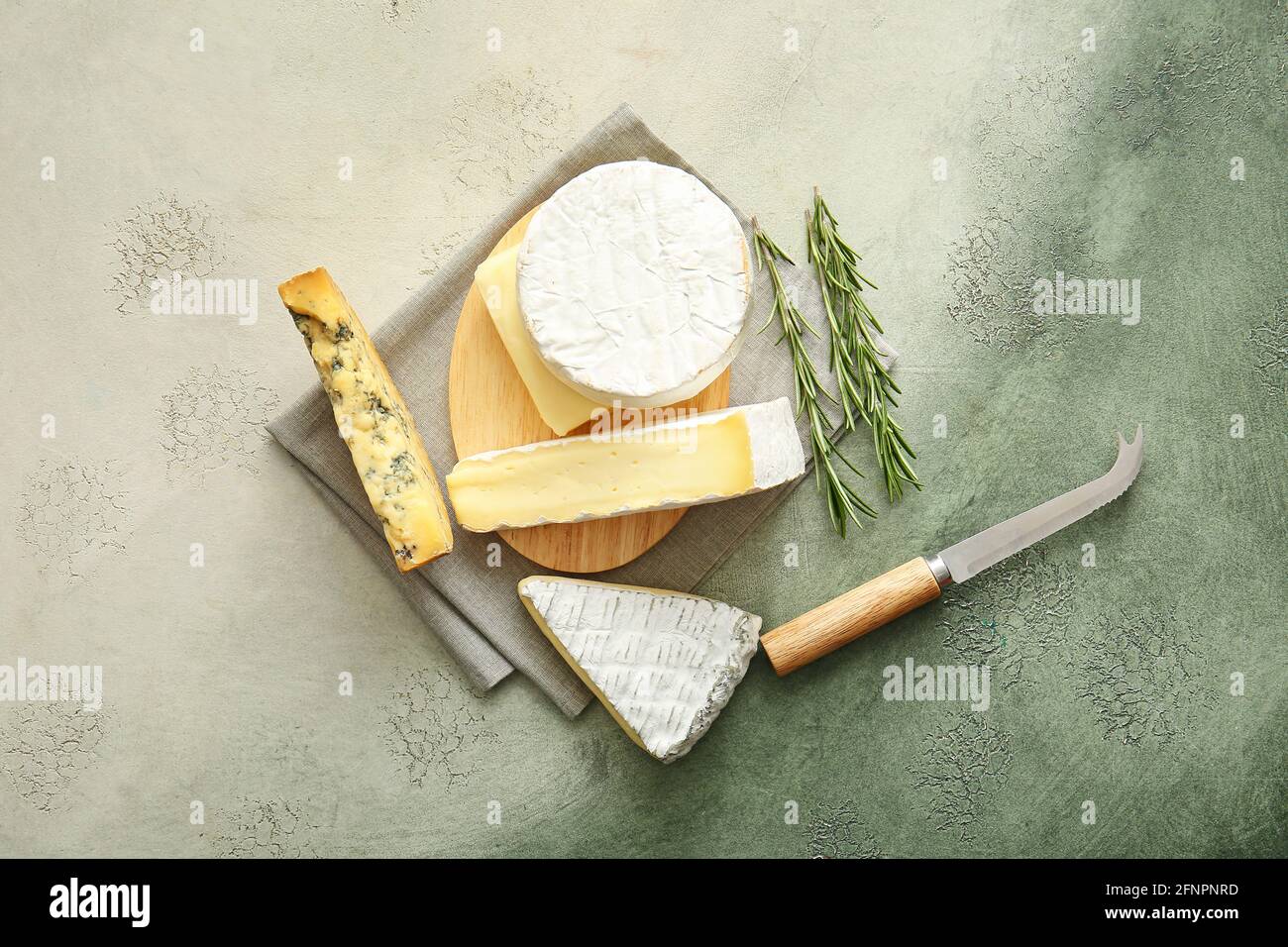 Different types of cheese on color background Stock Photo - Alamy