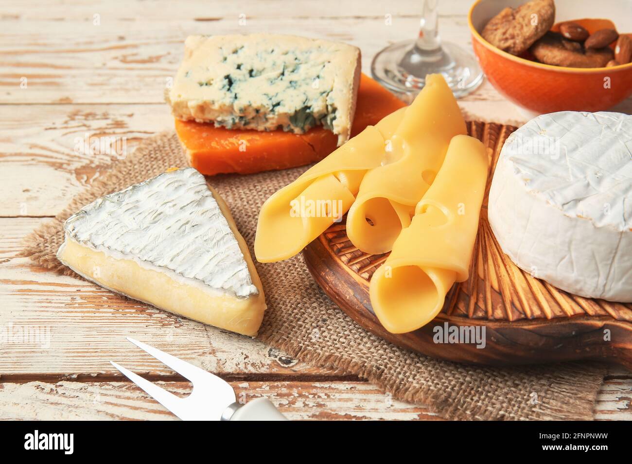 Different types of cheese on light background, closeup Stock Photo - Alamy