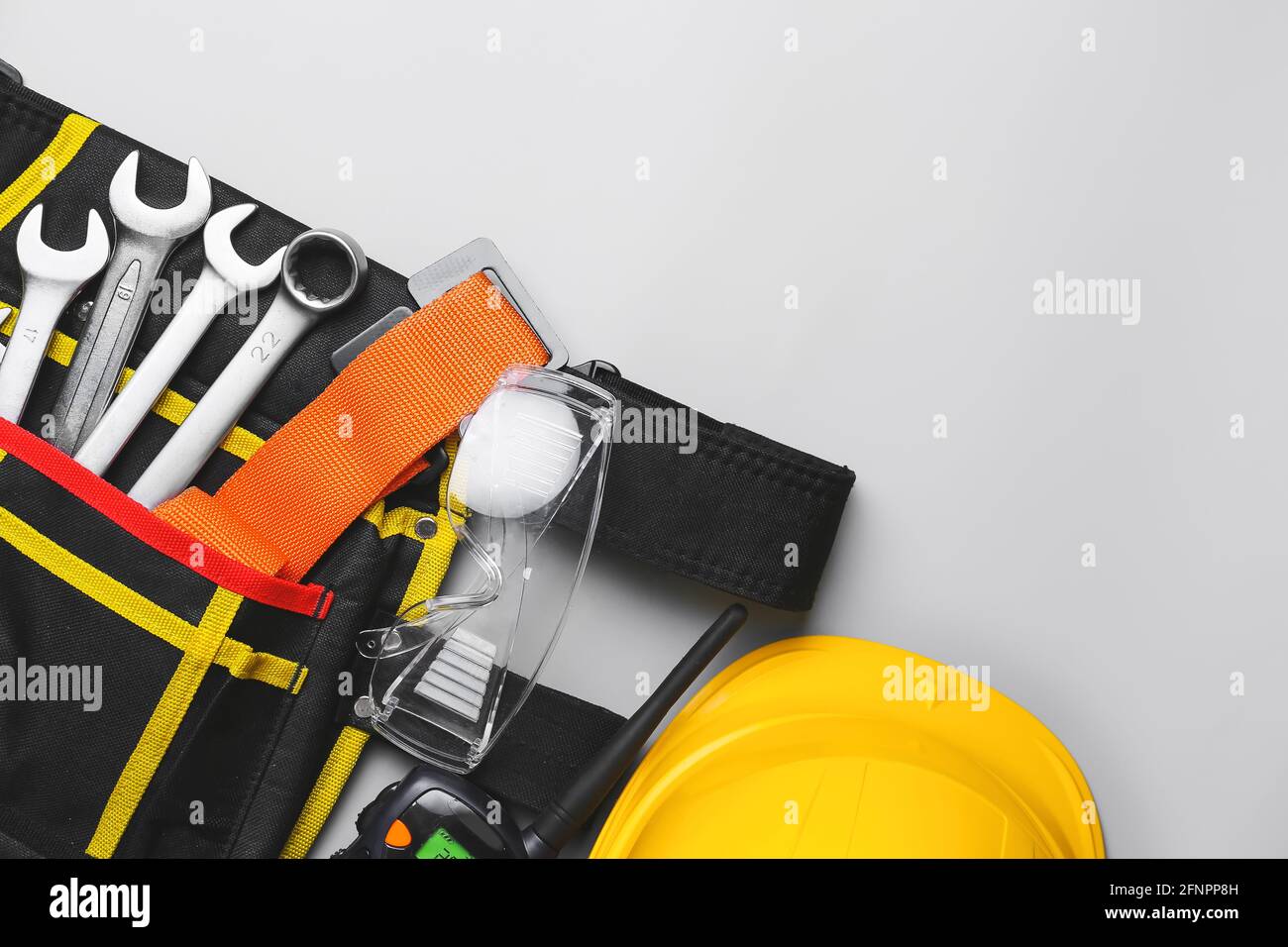 Bag with safety equipment on light background Stock Photo - Alamy