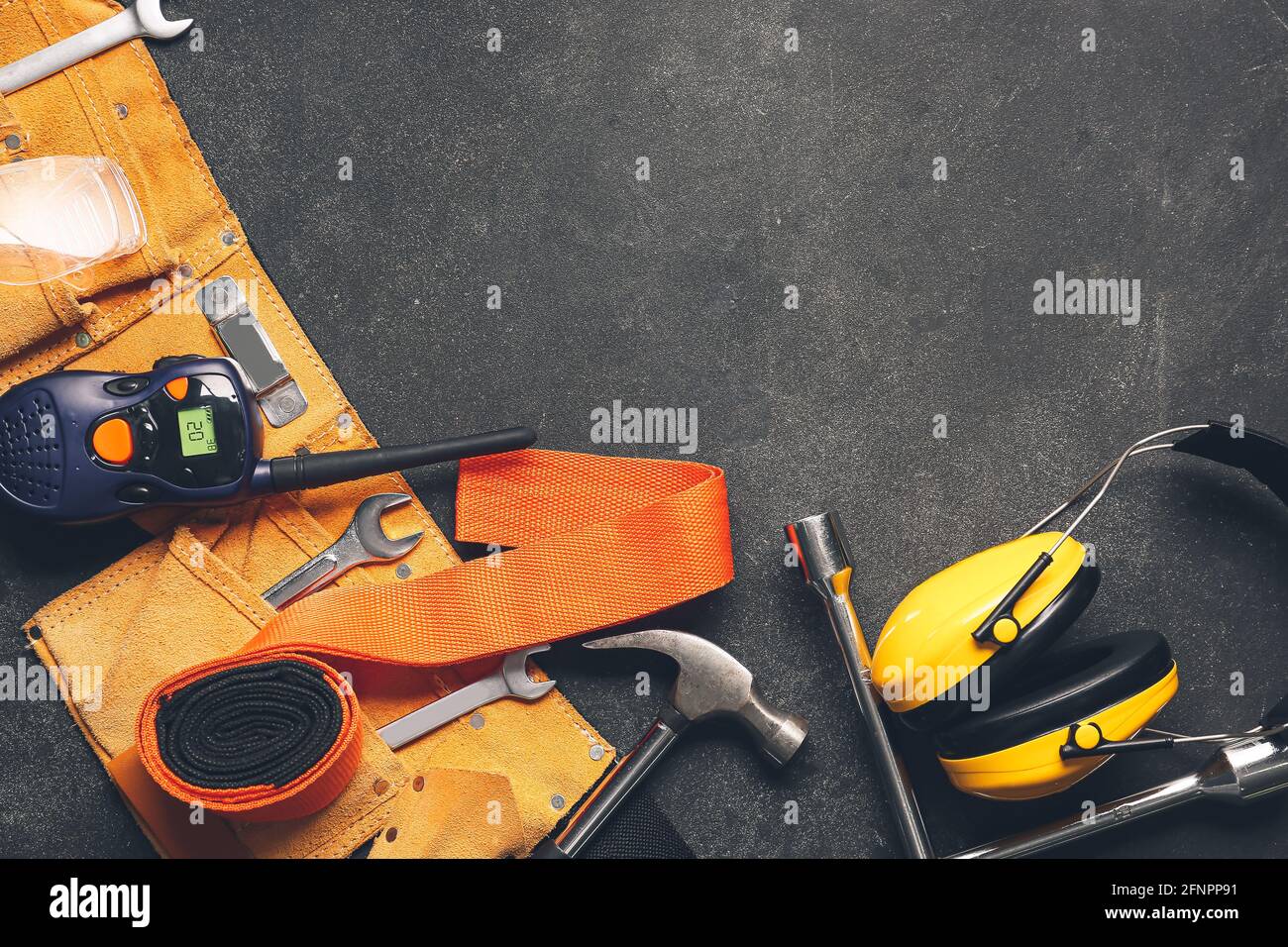 Safety equipment on dark background Stock Photo - Alamy