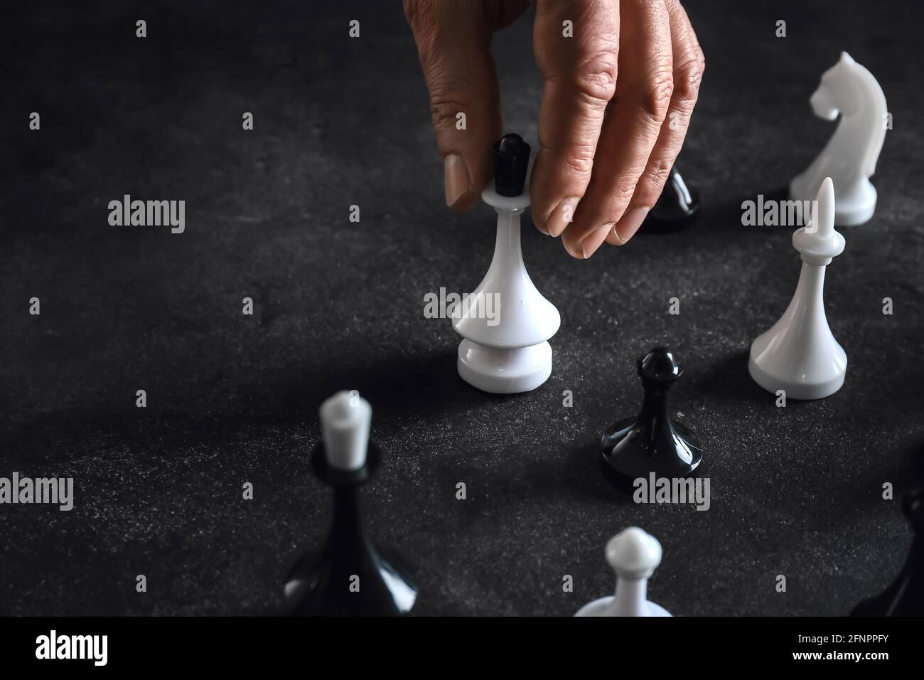Man playing chess on dark background Stock Photo - Alamy