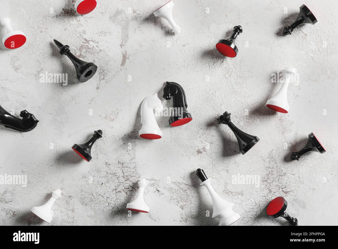 Chess pieces on light background Stock Photo - Alamy