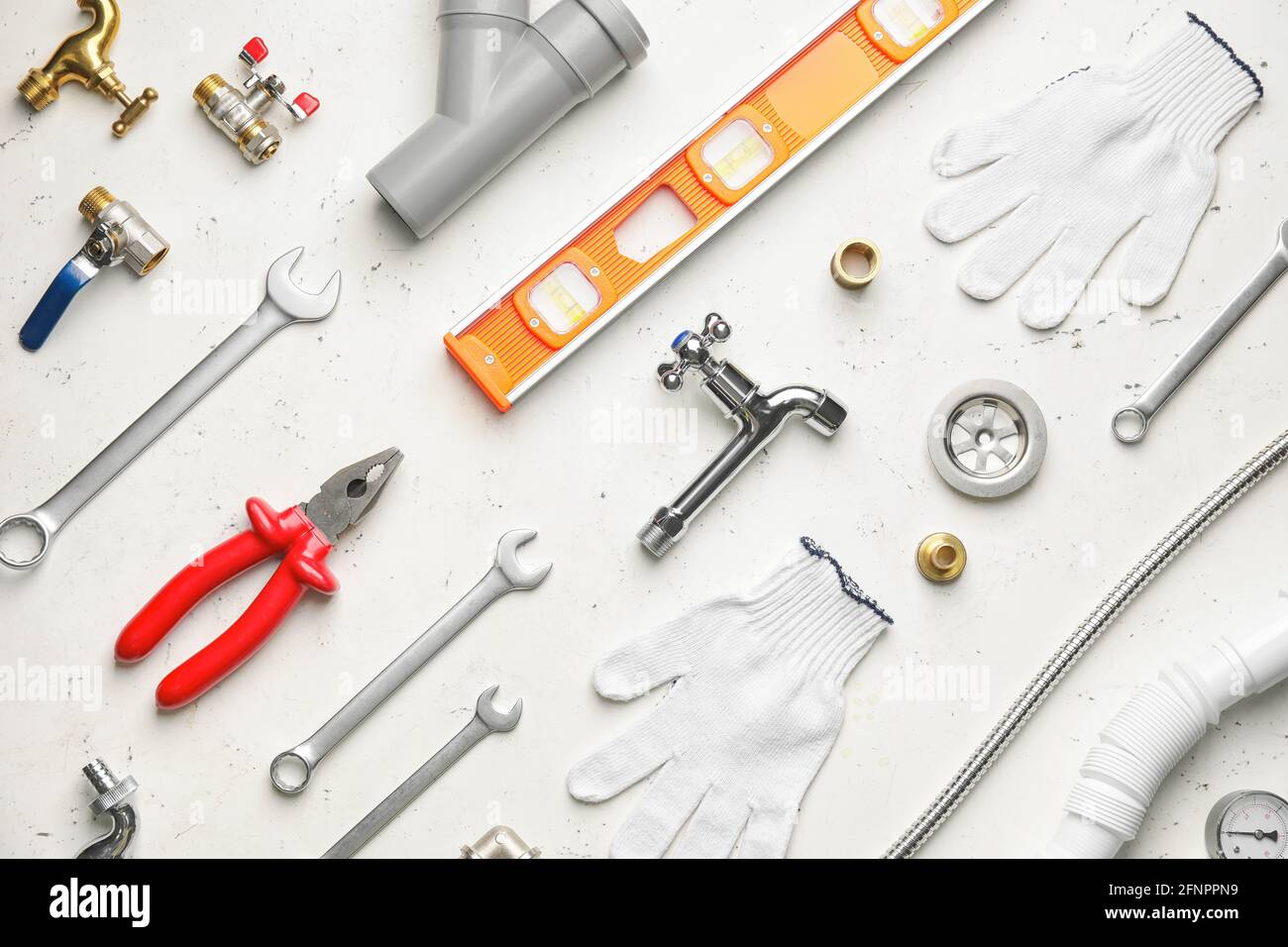 Set of plumber's items on light background Stock Photo - Alamy