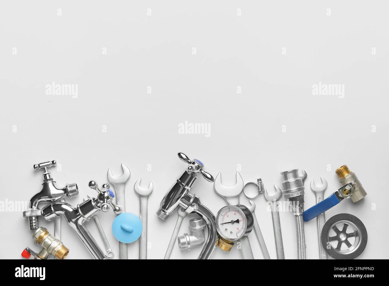 Set of plumber's items on light background Stock Photo - Alamy