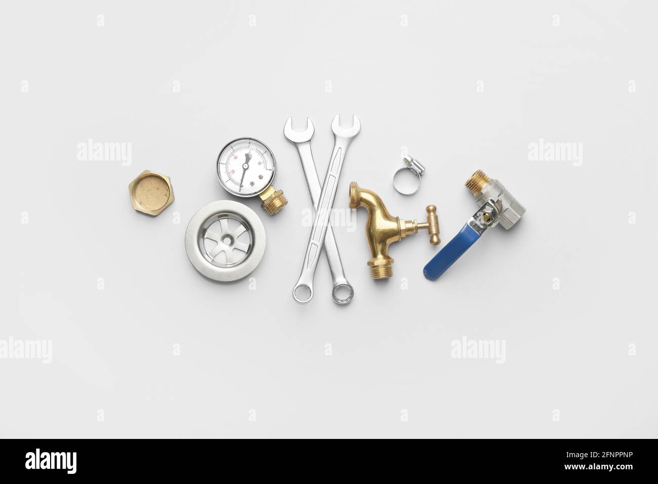 Set of plumber's items on light background Stock Photo - Alamy