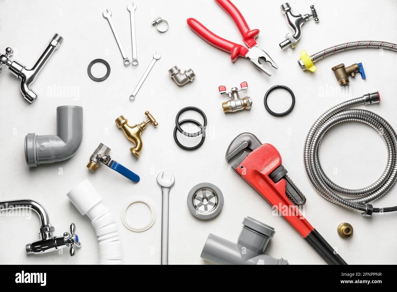 Set of plumber's items on light background Stock Photo - Alamy