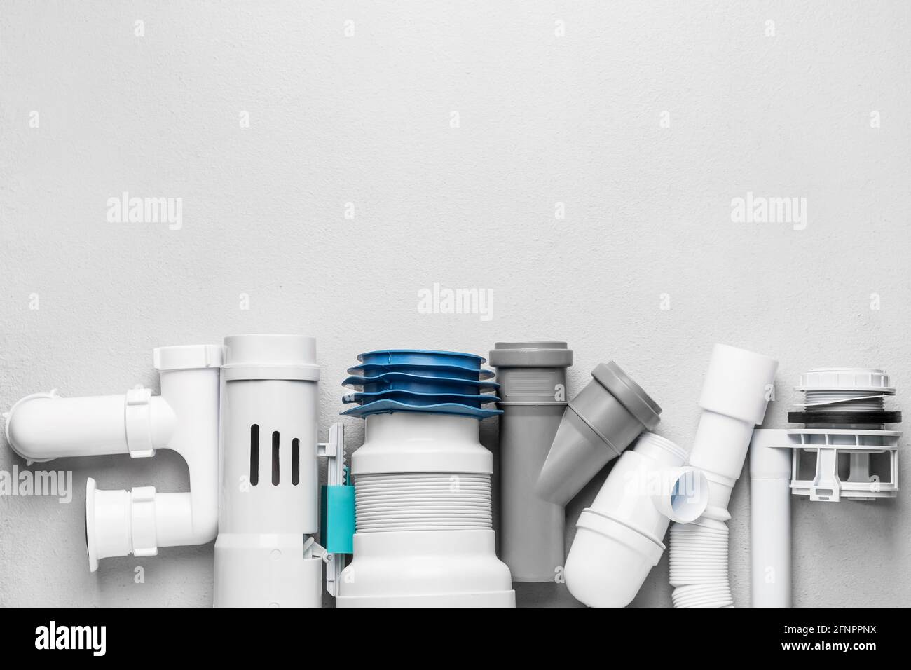 Set of plumber's items on light background Stock Photo - Alamy